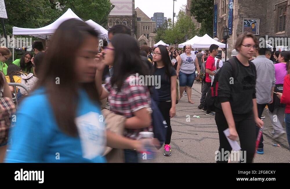 Crowds of diverse college and university students on campus in Toronto ...