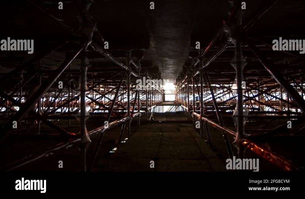 Industrial.Interior structure,of a big building.Scaffolding,work in ...