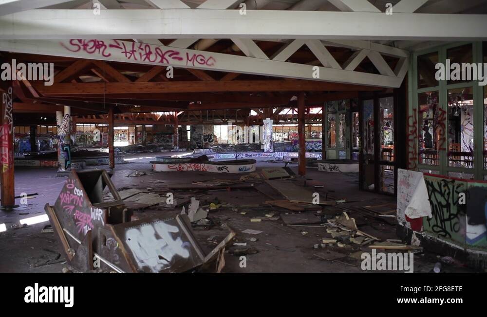 Inside huge abandoned indoor swimming pool theme park, graffiti ...