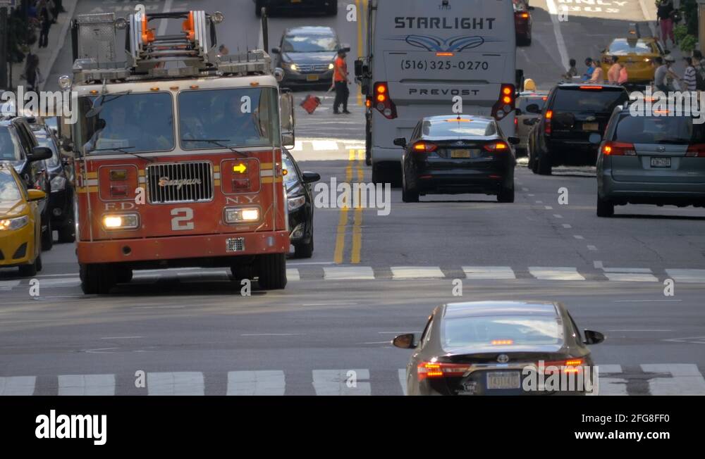 Car traffic at zebra crossing at intersection Stock Videos & Footage ...