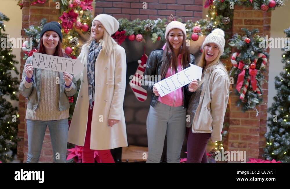 Cute Girls Pose With Naughty And Nice Signs For Christmas Portraits 3743