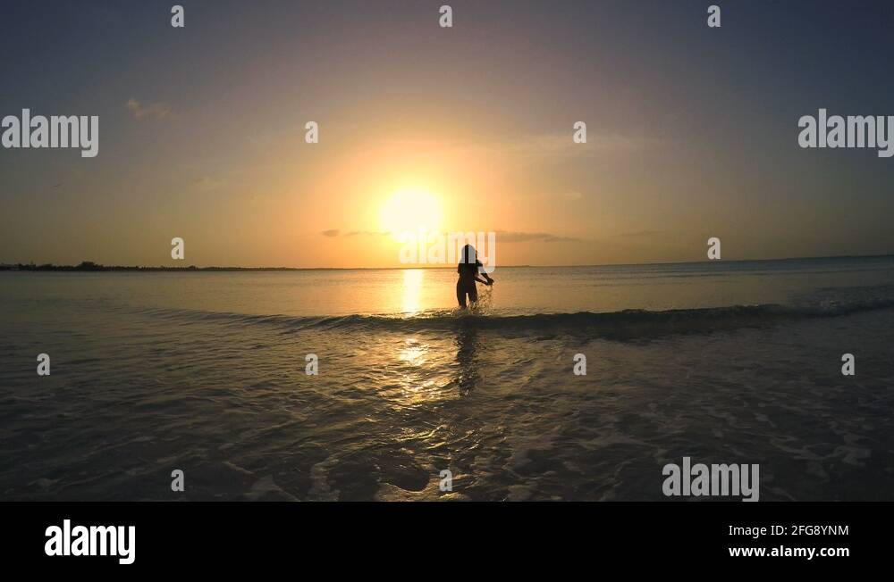 Sunrise beautiful Asian Chinese girl in bikini on the beach Stock Video ...