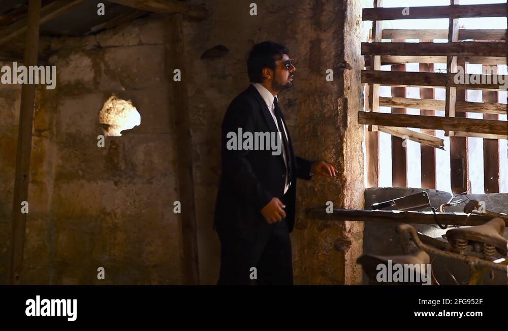 Mafia gangster window peek danger Stock Video Footage - Alamy