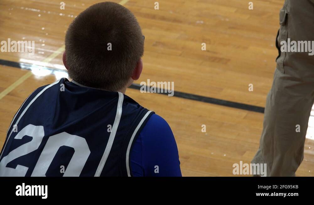 Teen basketball player put into game from bench 4k Stock Video Footage ...
