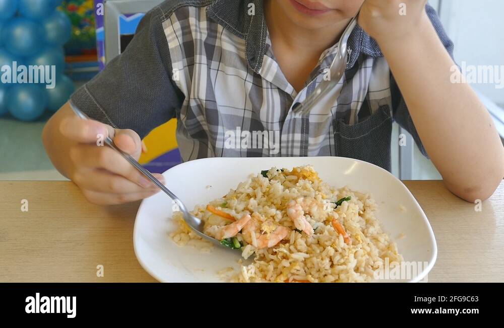 Eating fried rice Stock Videos & Footage - HD and 4K Video Clips - Alamy
