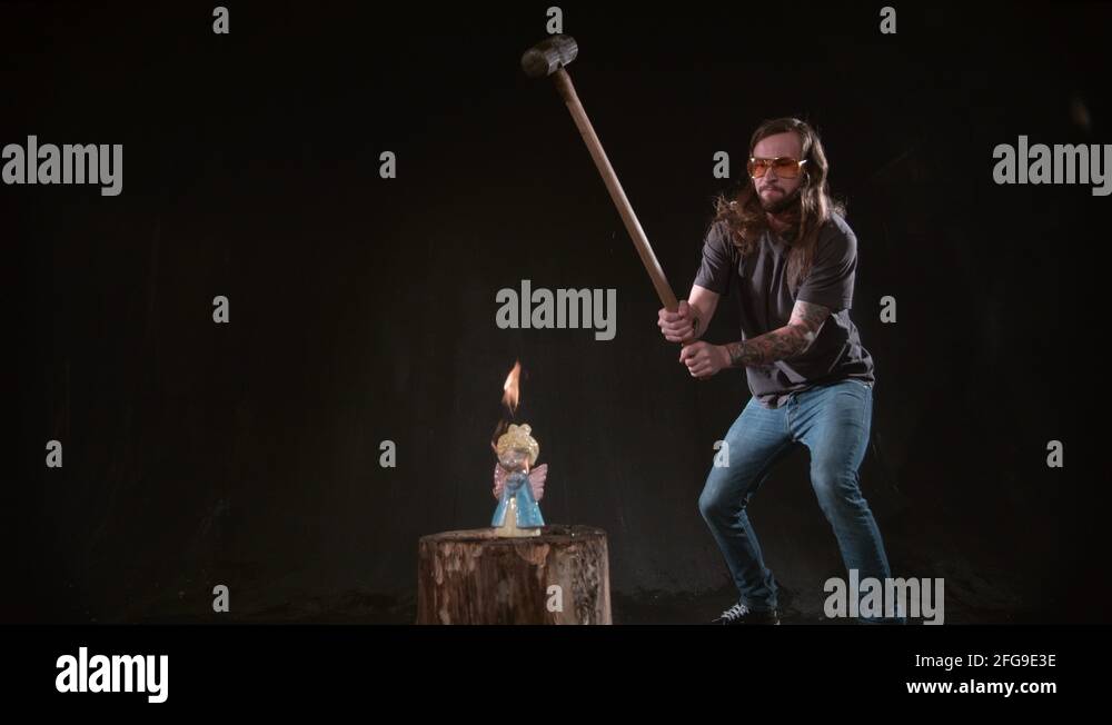 Man smashing ceramic angel with hammer in slow motion, shot on Phantom ...