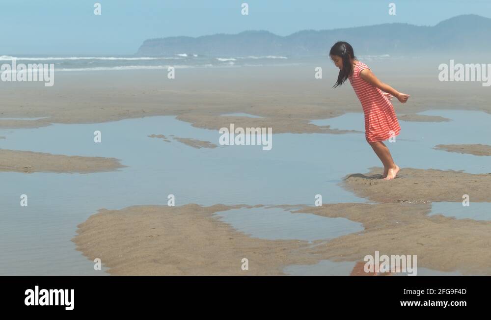 Girl jumping into puddle Stock Videos & Footage - HD and 4K Video Clips ...