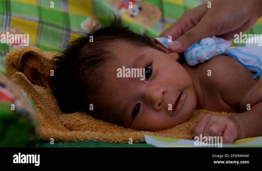 Mother changing baby boy Stock Video Footage - Alamy