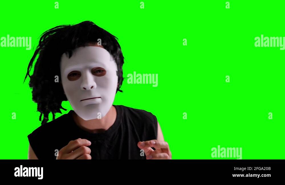 4K Green Screen Scary Masked Man Looking Around Stock Video Footage - Alamy
