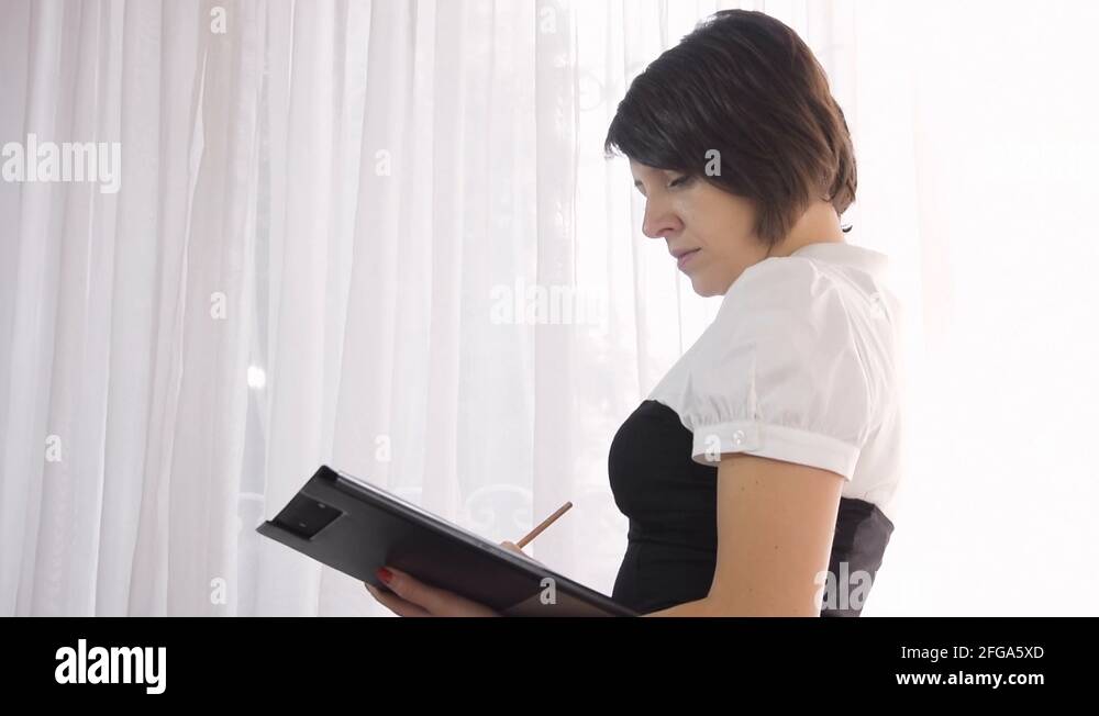Business woman standing taking notes Stock Videos & Footage - HD and 4K ...
