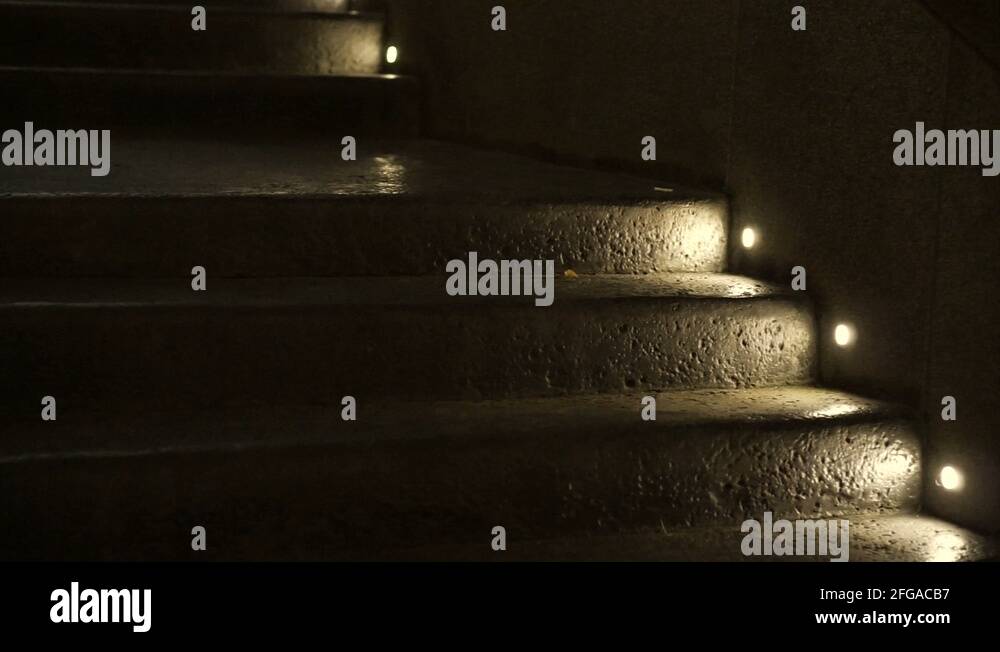 step light at night lit on raw concrete texture Stock Video Footage - Alamy