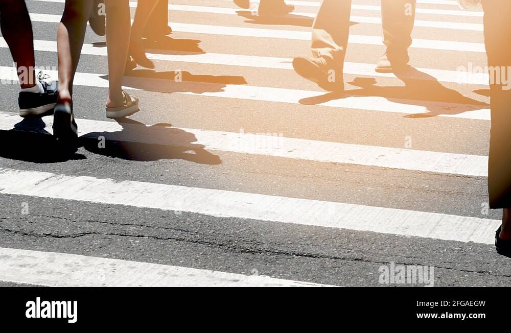 crowd of people crossing street in new york city. workers commuting ...