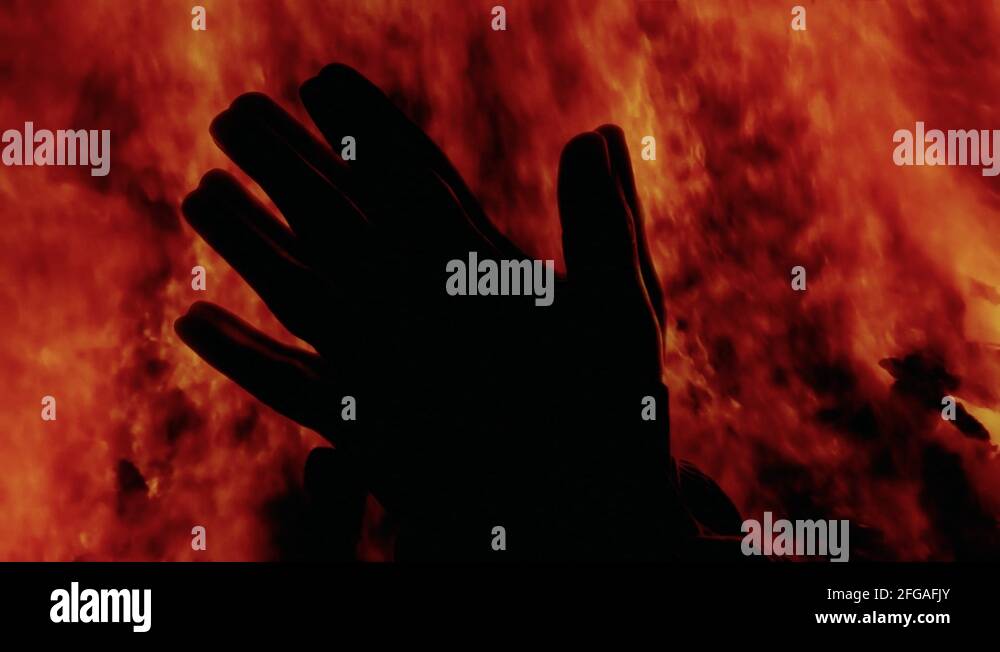 Praying hands DE wild fire Stock Video Footage - Alamy