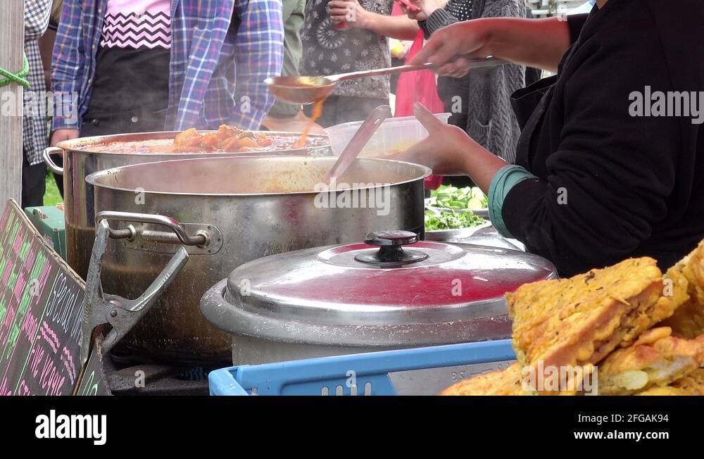 street food serving on a live event: stand of asian street food Stock ...