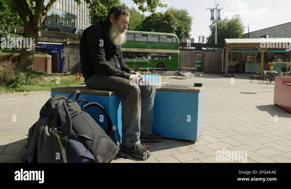 homeless old man sitting alone and sad in the city Stock Video Footage ...