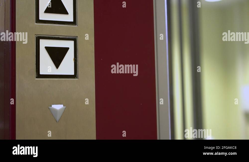Hand pressing down arrow for elevator 4k Stock Video Footage - Alamy