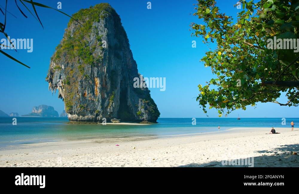Massive Limestone Formation Towers over Tropical Beach Paradise ...