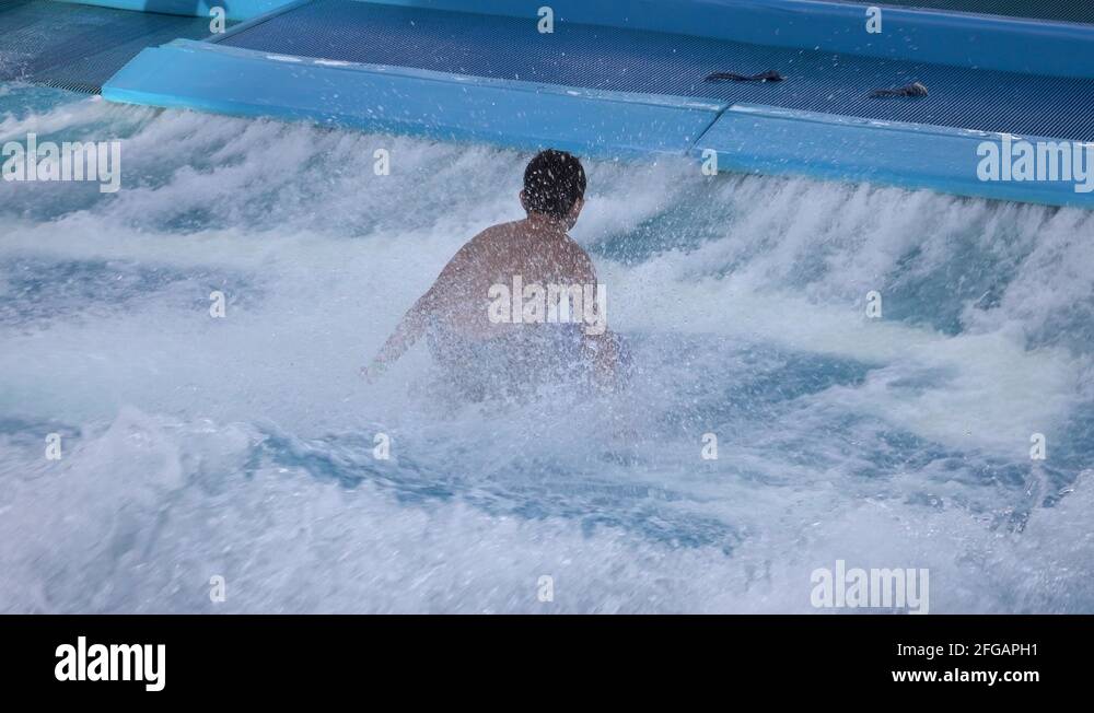 Grand Cayman cruise ship boy knee board surfing 4K Stock Video Footage ...