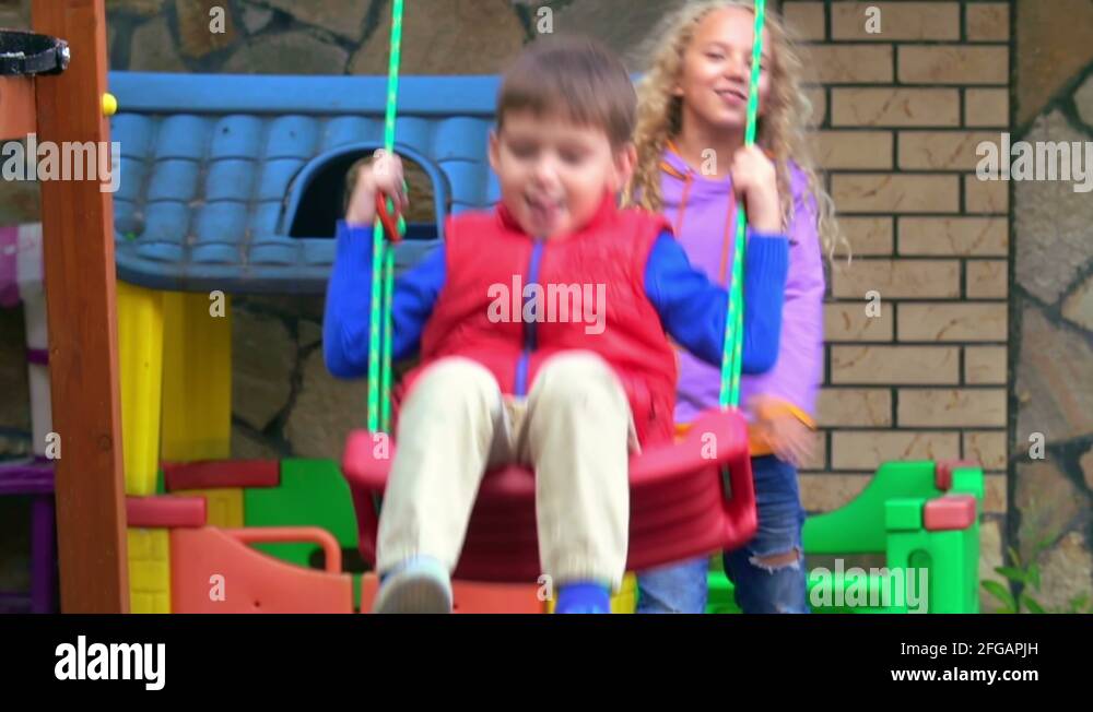 Pushing sibling Stock Videos & Footage - HD and 4K Video Clips - Alamy