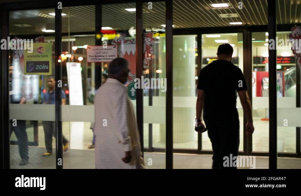 Entrance of Bahrain Airport. Passengers Departing and Arriving Stock ...