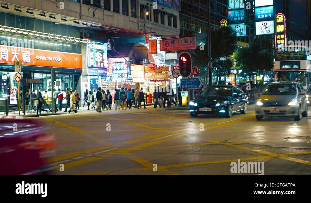 Busy pedestrian and vehicle traffic at major Hong Kong intersection, at ...