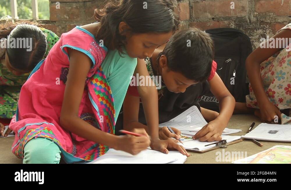 Female students sketch and draw at a school for underprivileged kids ...