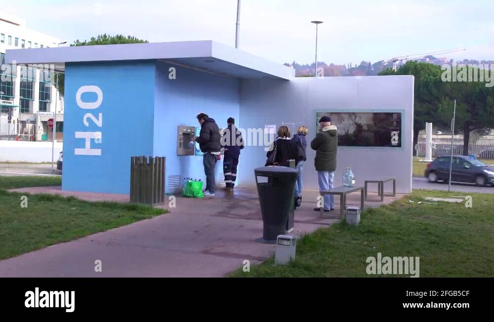 People pour free water from a specially equipped source Stock Video ...