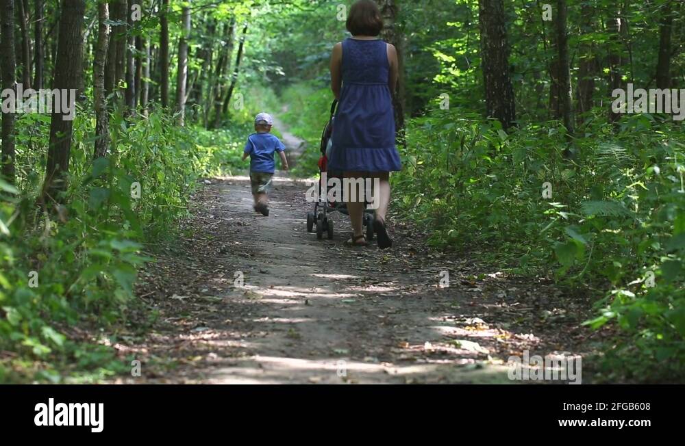 Mother and baby walking by forest path. Full HD Stock Video Footage - Alamy
