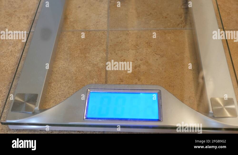 Step on the scale Stock Videos & Footage - HD and 4K Video Clips - Alamy