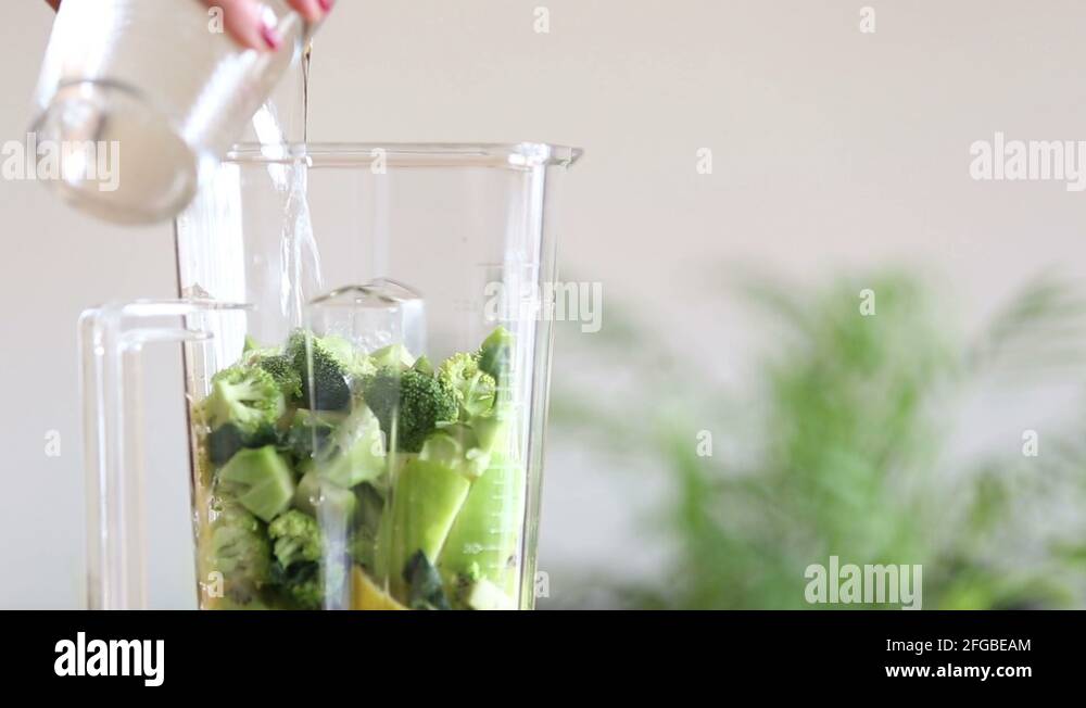 Pouring water in blender with fruits and vegetables Stock Video Footage ...