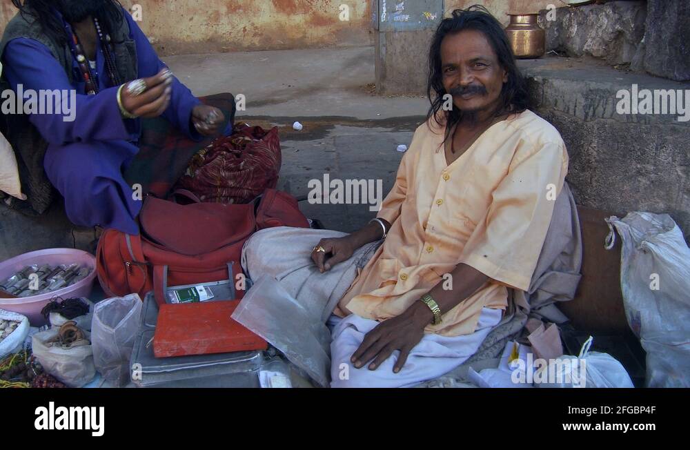 three indian men squatting in traditional india clothes Stock Video ...