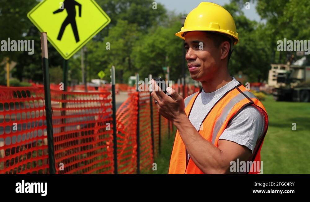 Construction worker giving directions Stock Video Footage - Alamy