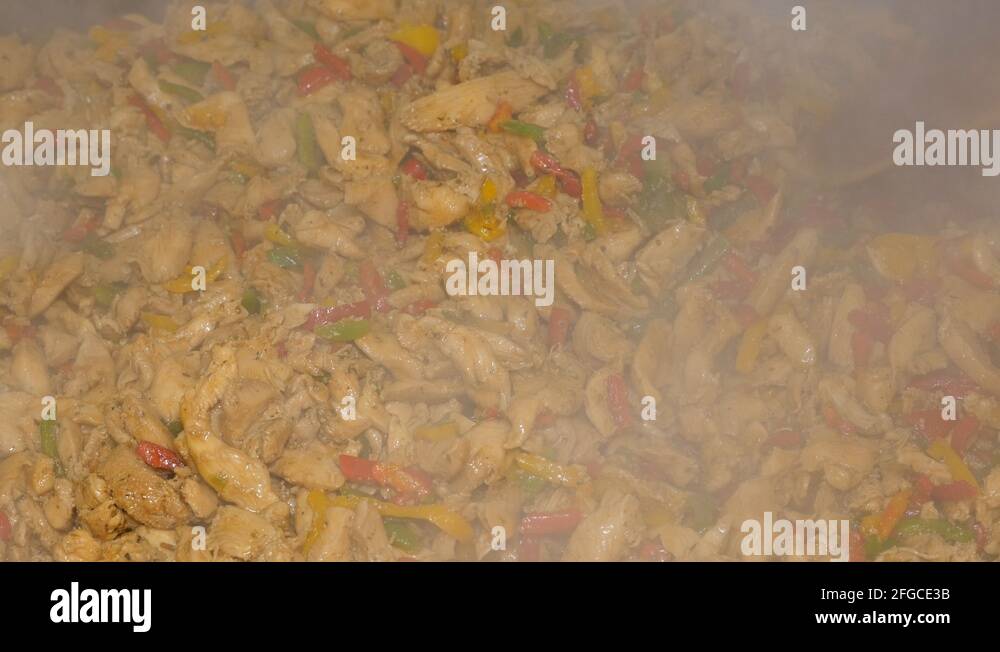 Marinating 20kg of chicken filet in a professional Restaurant kitchen ...