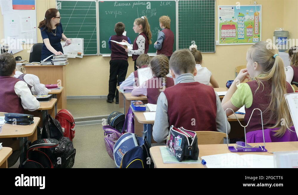 Back view of elementary school students in the classroom, Full HD shot ...