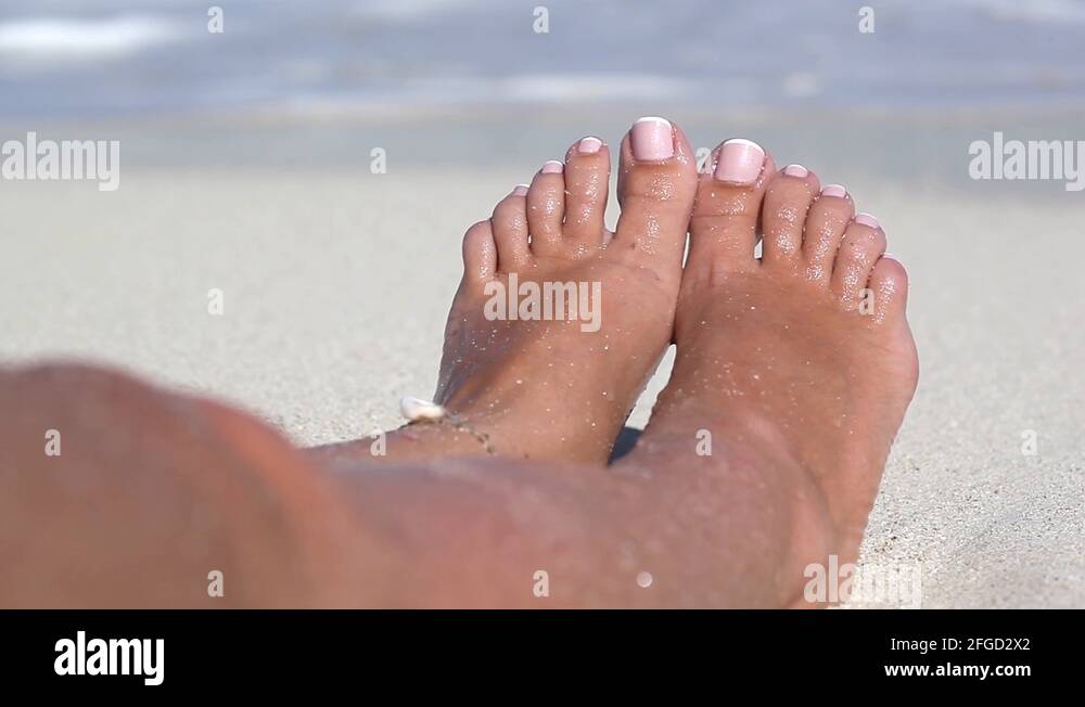 Female toe on sandy beach in caribbean sea waves Stock Video Footage ...