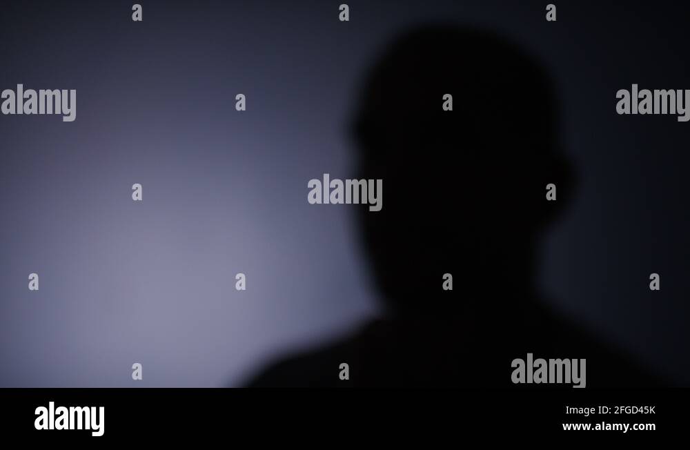4K Blurred silhouette of anonymous person talking to keep identity ...