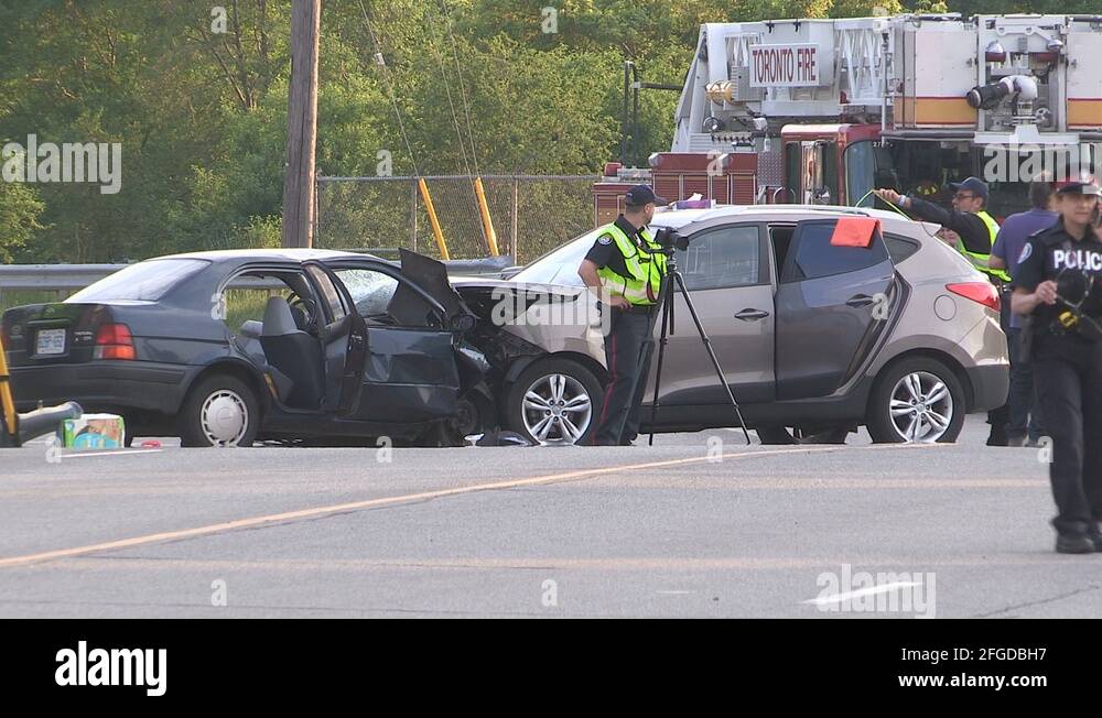 Deadly fatal head on car crash in city of Toronto intersection Stock ...