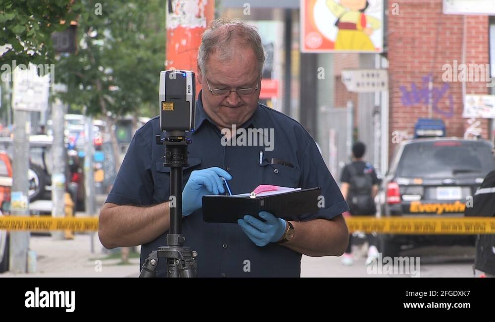 Police officers at shooting murder and crime scene in downtown Toronto ...