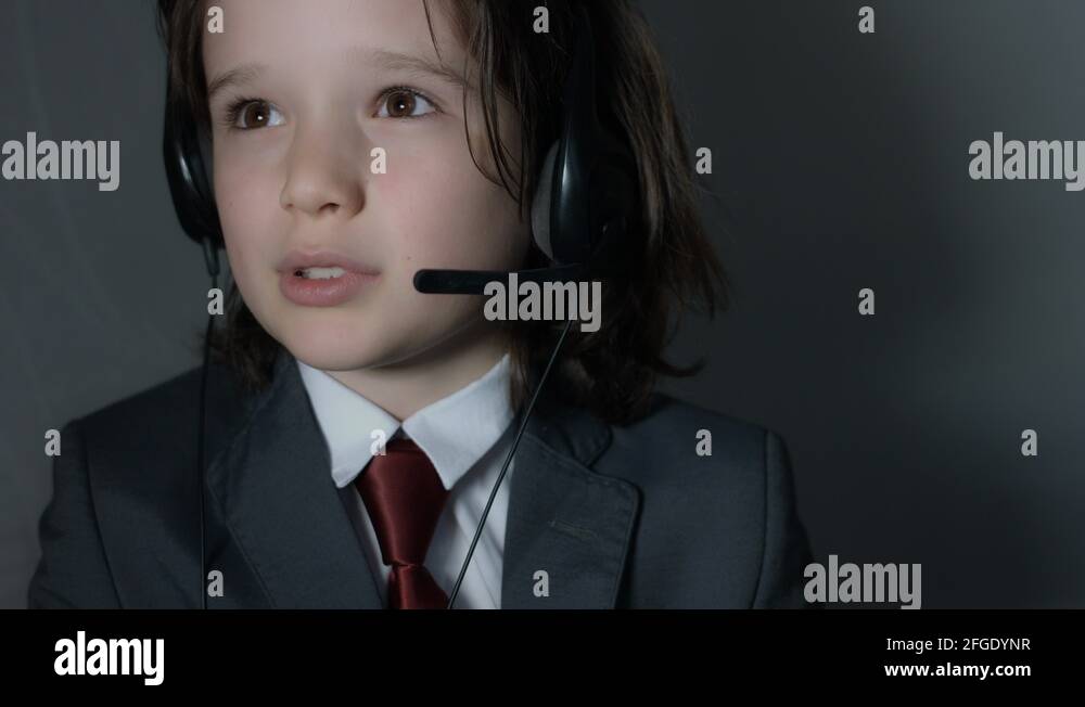 4k shoot of a cute child posing as a business man in studio - Customer ...