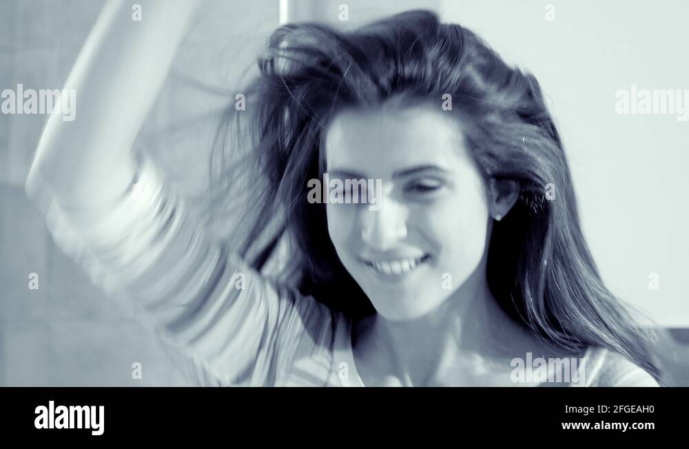 Beautiful female model moving long hair slow motion dancing black and ...