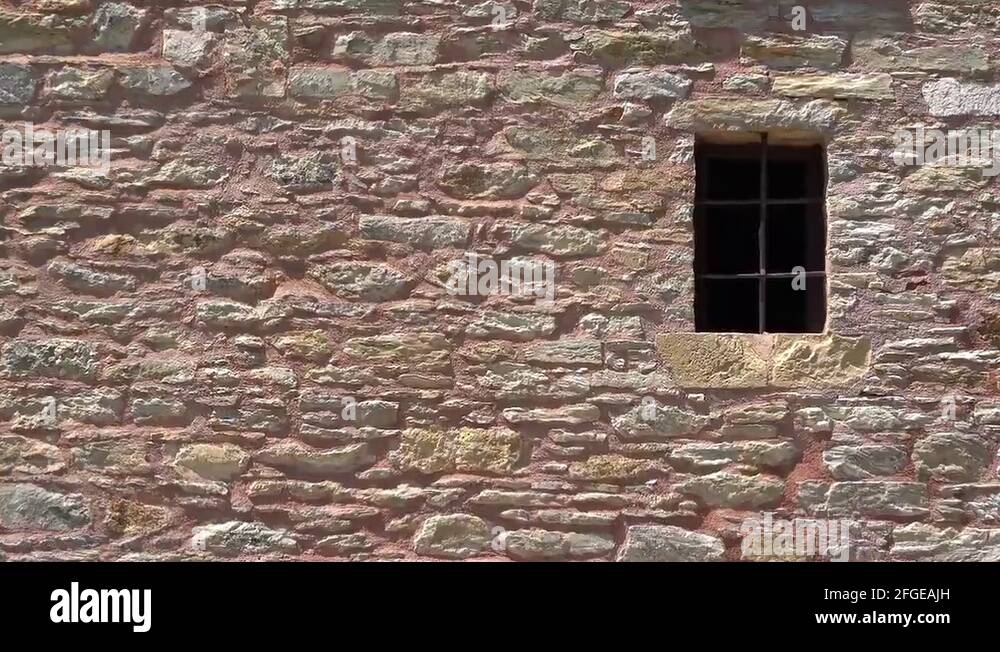 Old prison stone wall and window with bars Stock Video Footage - Alamy