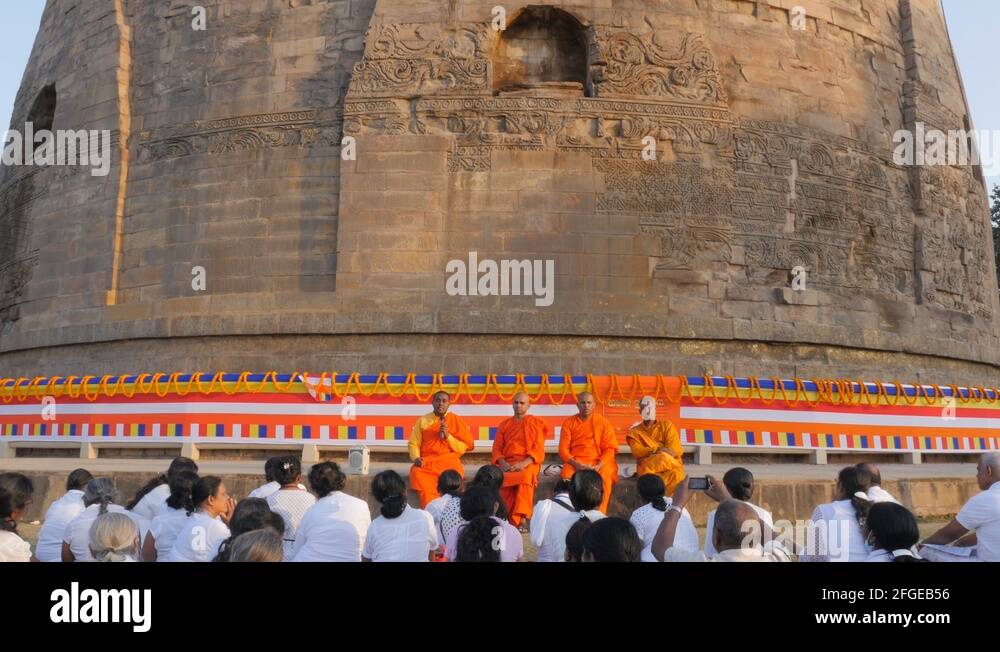 Buddhist monks teach pilgrims at Dhamekh Stupa,Sarnath,India Stock ...