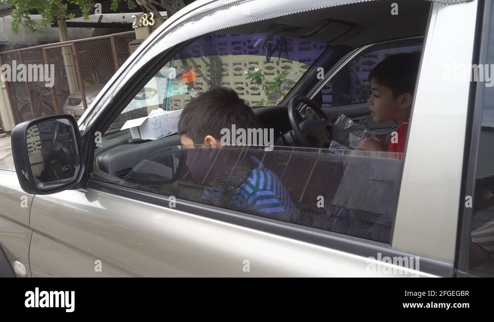 Little boy waving hand open the window in the car Stock Video Footage ...