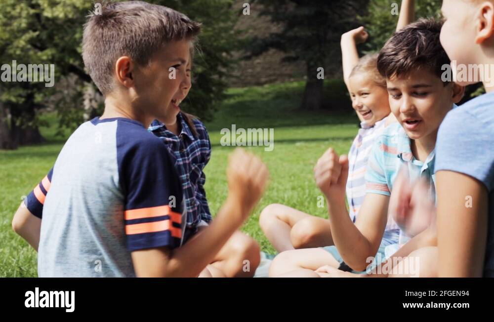 happy kids playing rock-paper-scissors game Stock Video Footage - Alamy