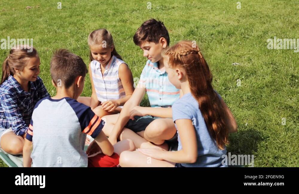 group of happy kids putting hands together Stock Video Footage - Alamy
