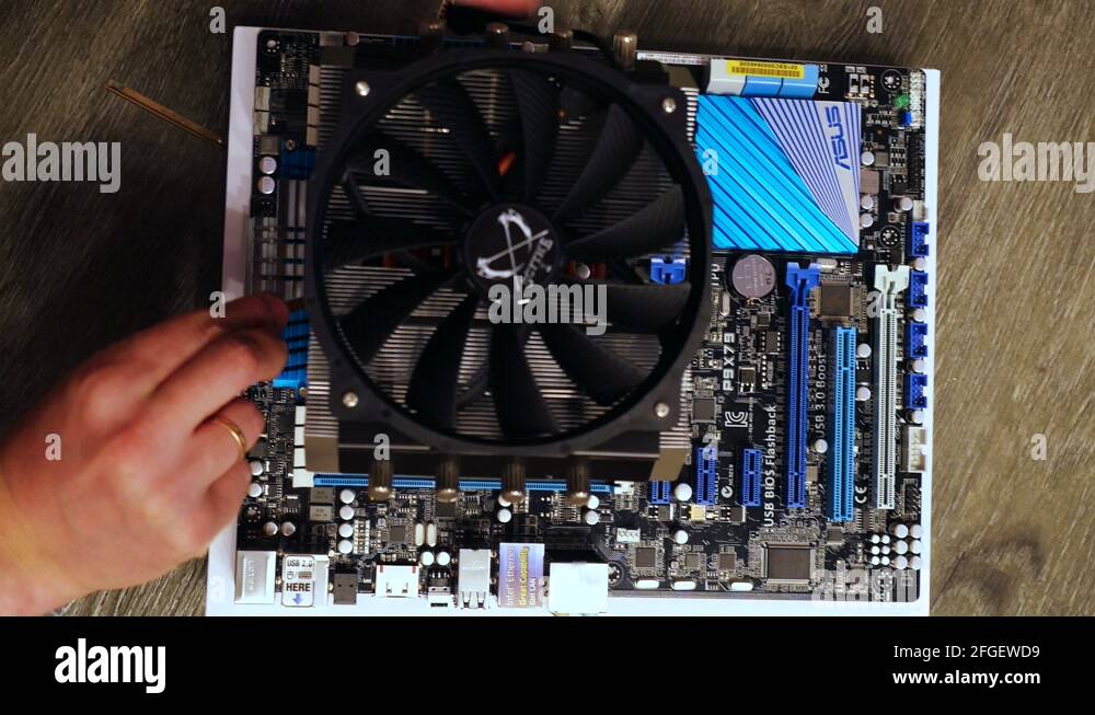 Setting up cooler to CPU processor at motherboard. 3840x2160 Stock ...