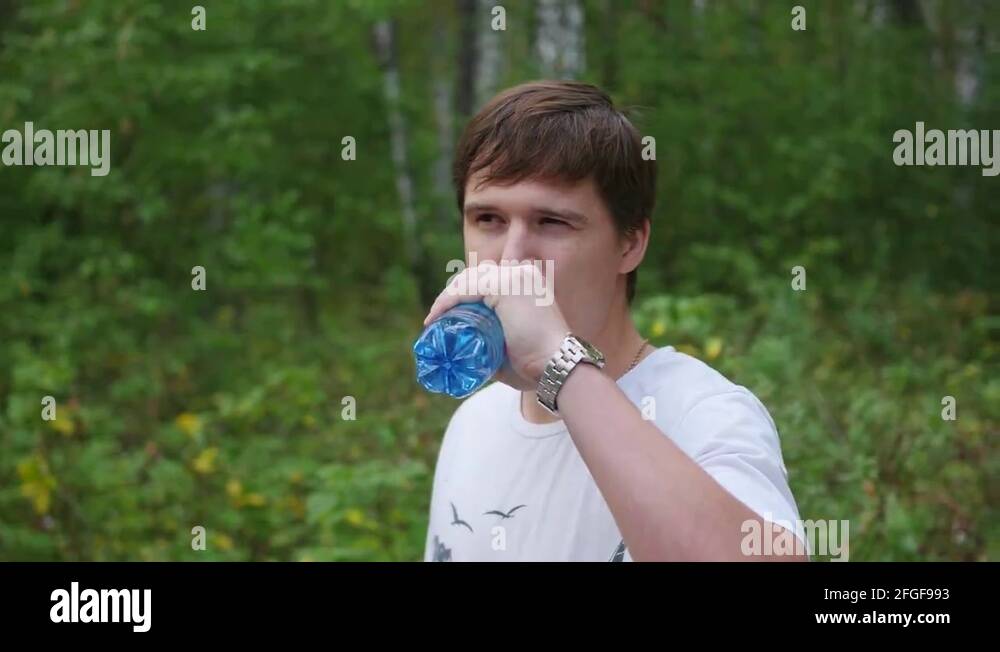 guy drinking water from bottle Stock Video Footage - Alamy