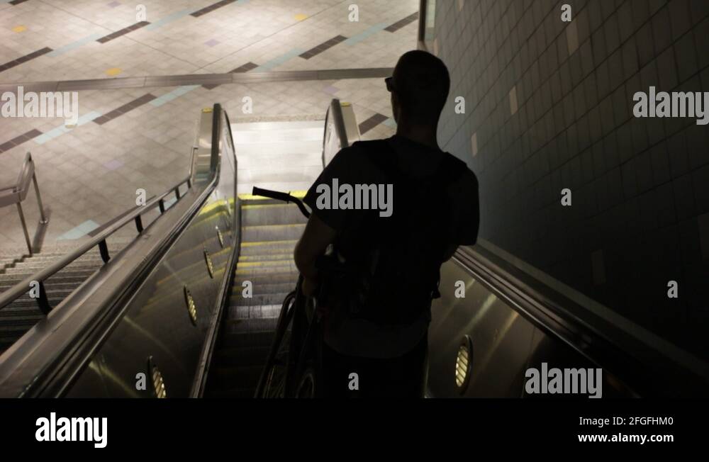 Man bike escalator Stock Videos & Footage - HD and 4K Video Clips - Alamy