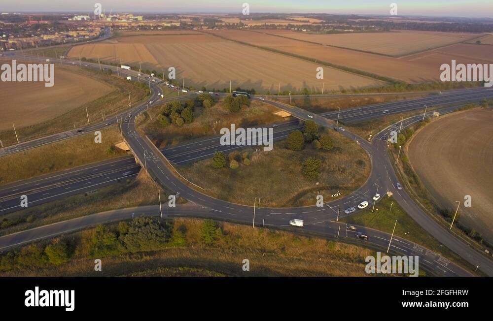 Busy roundabout, motorway junction, aerial view Stock Video Footage - Alamy