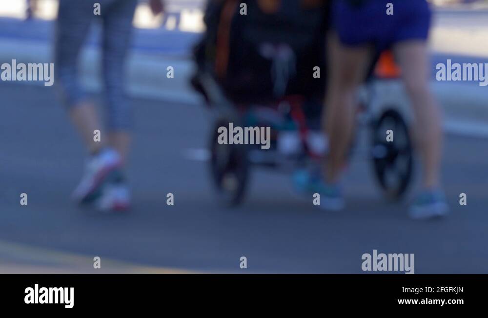 The back of a crowd of people running in a 10K race Stock Video Footage ...